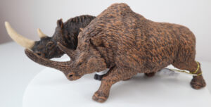 A Pair of Woolly Rhino Models on a Turntable